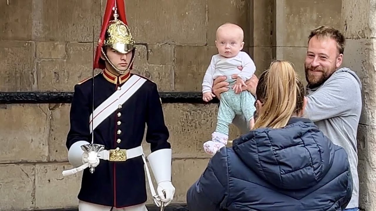 Peter Ellis Enjoys a Lovely Moment with a Happy Baby
